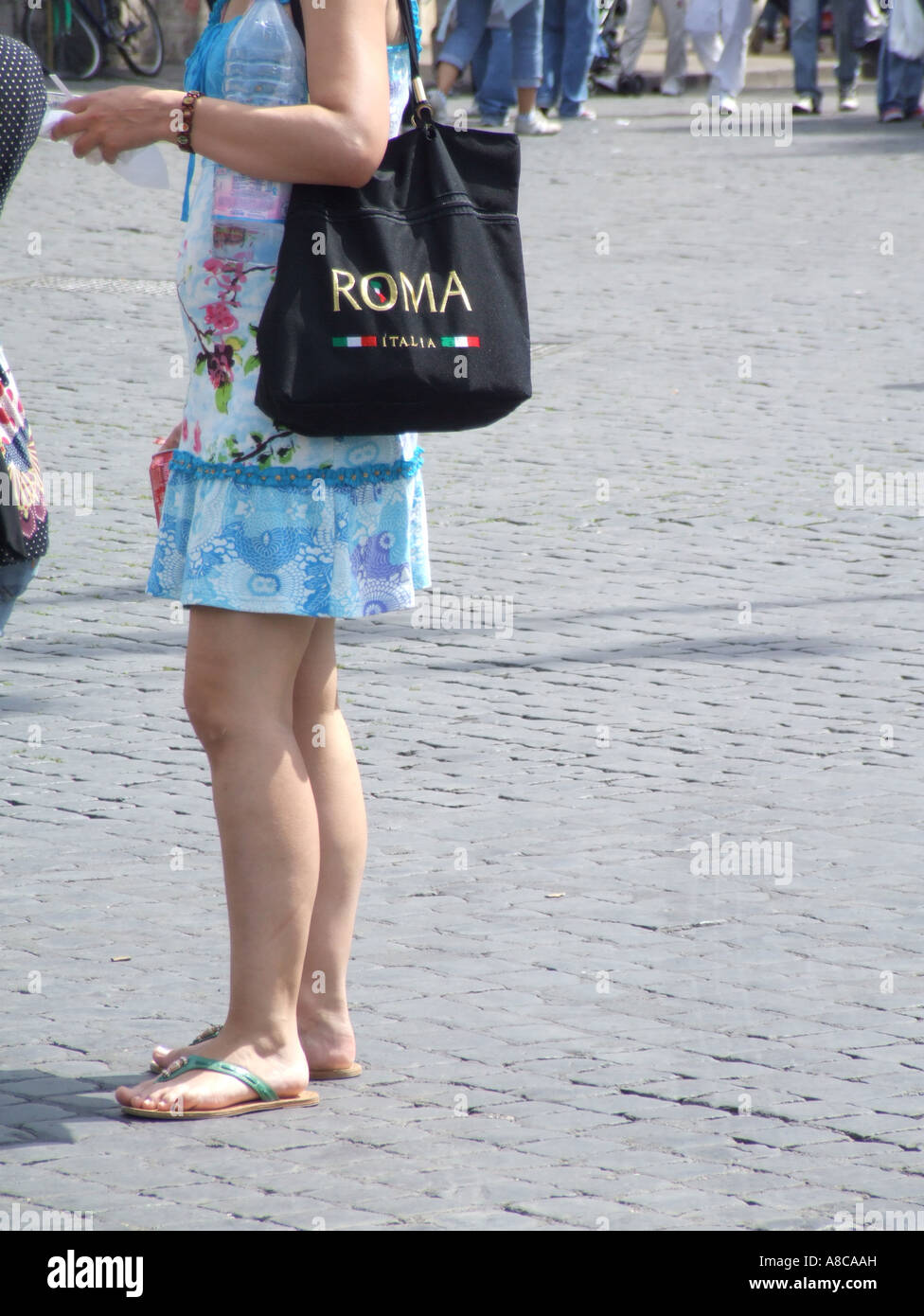 one person walking in street in city town rome Stock Photo - Alamy