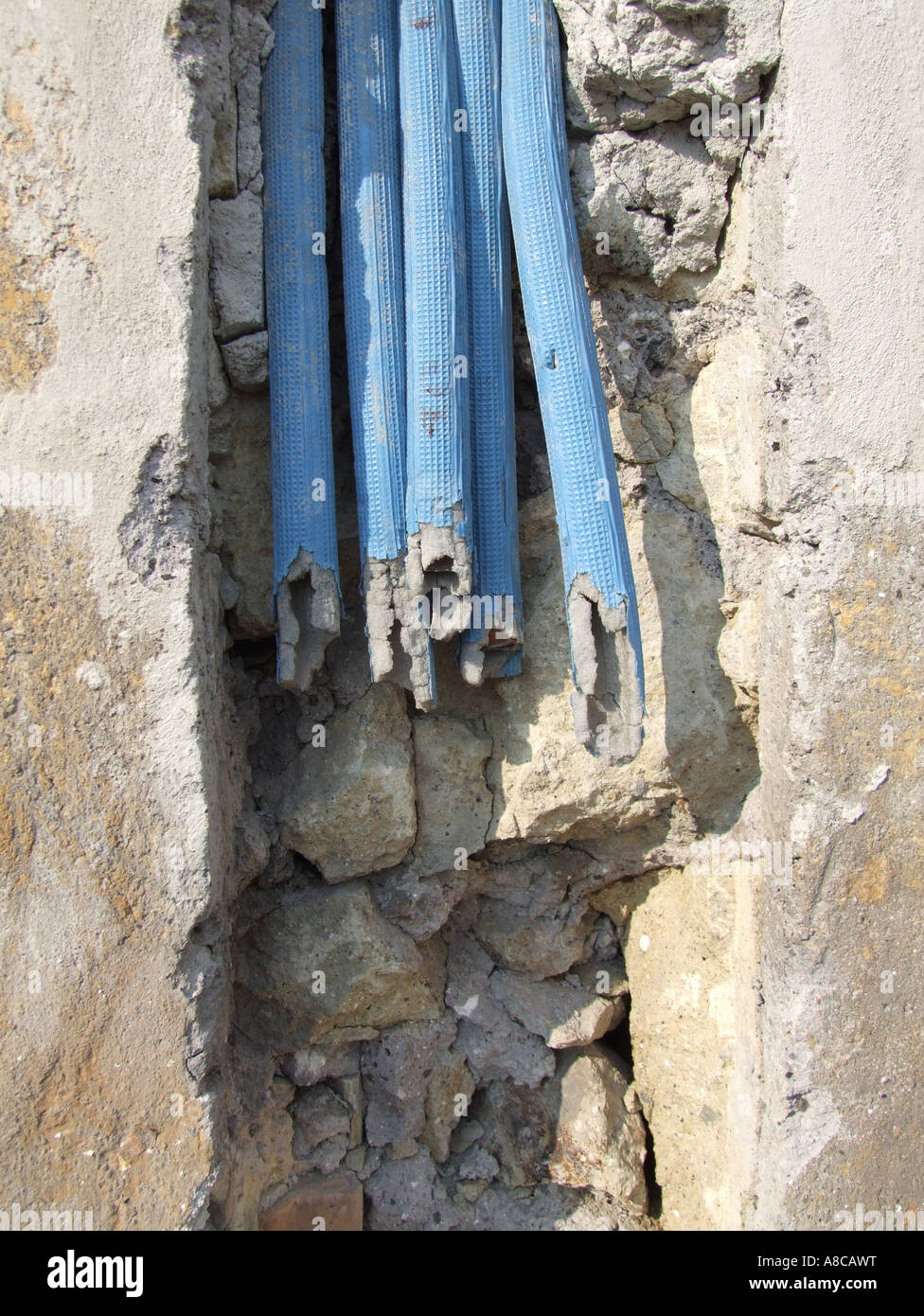 damaged pipes on property wall Stock Photo - Alamy