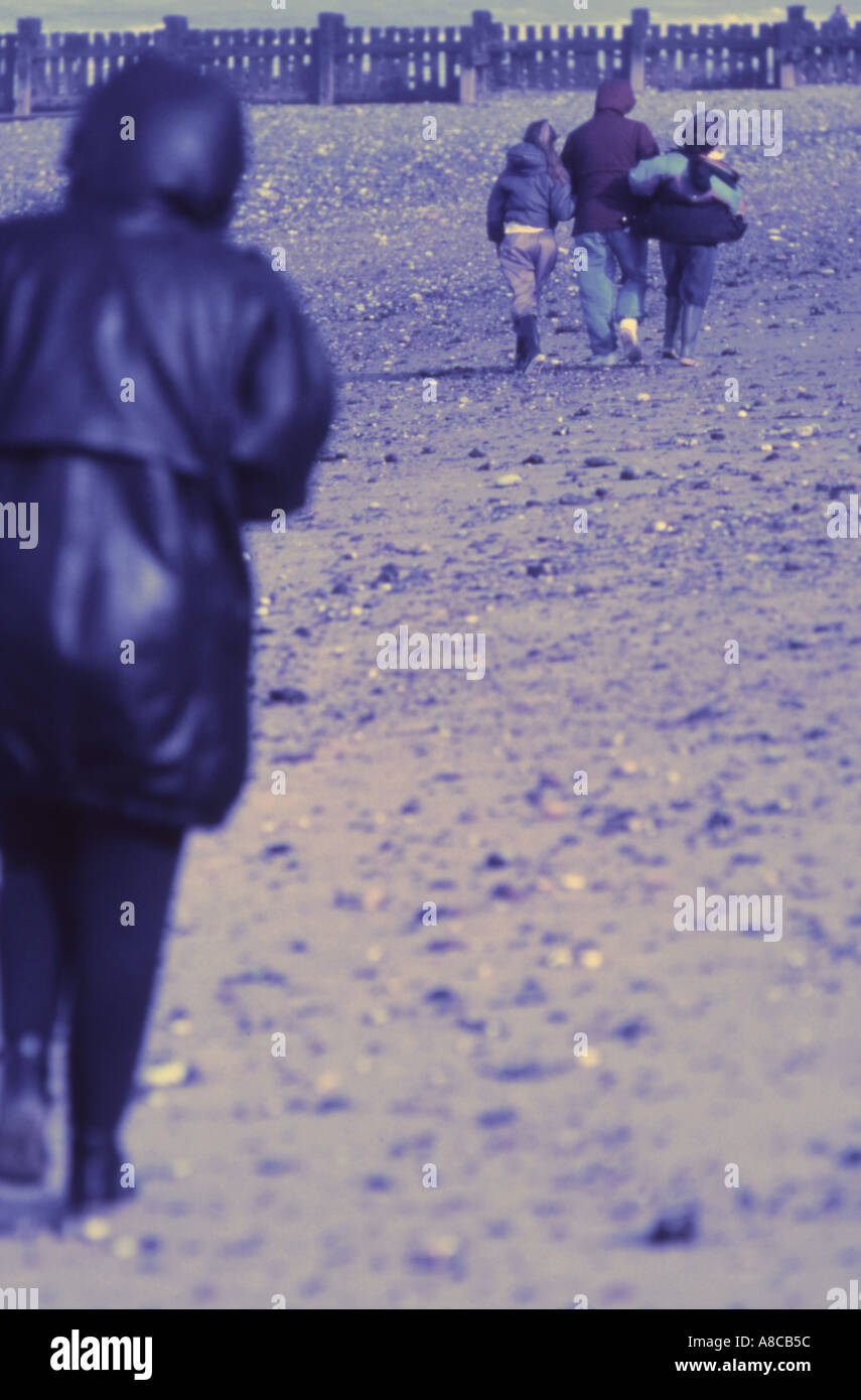 Stalker follows mother and children Stock Photo - Alamy