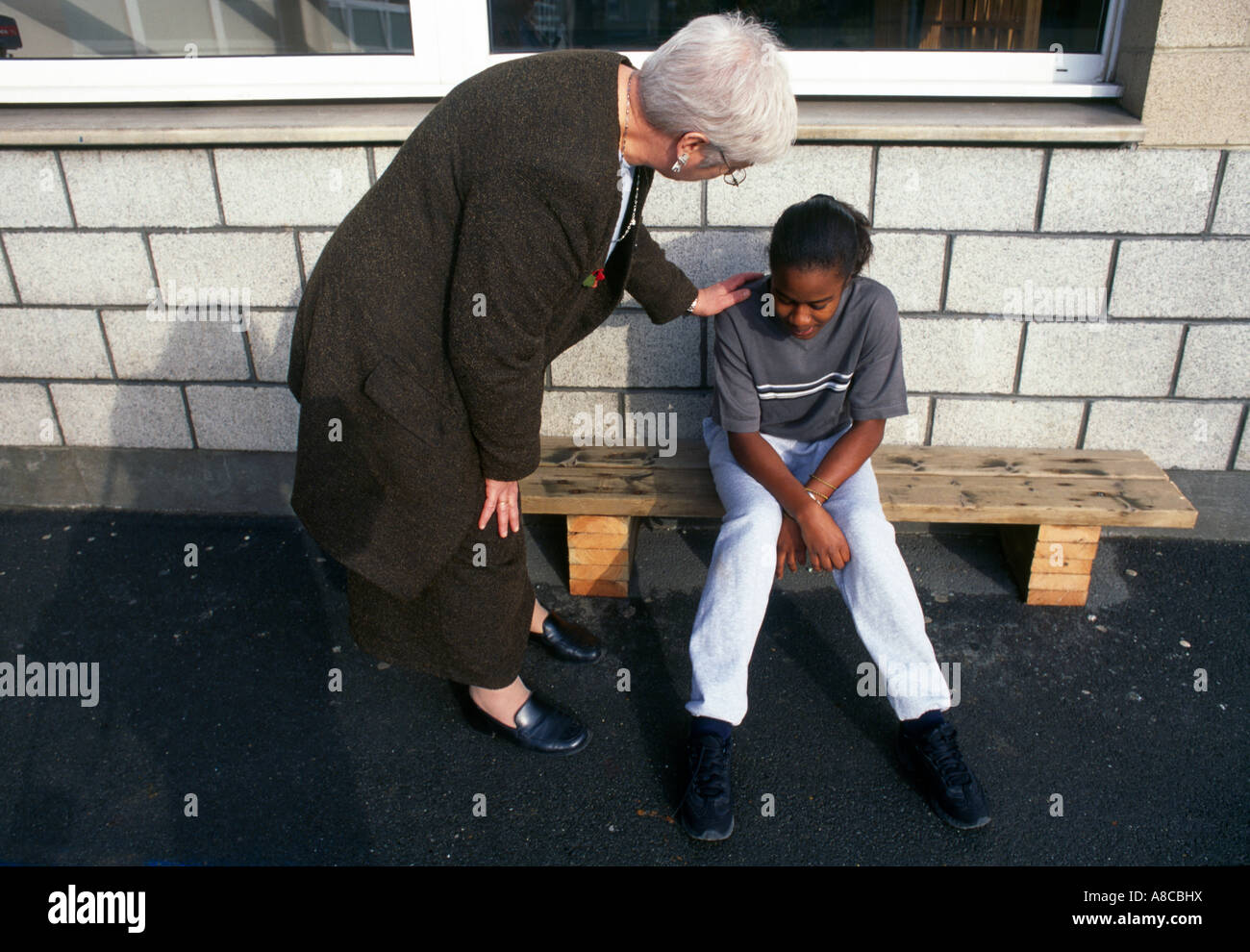 Teacher student comforting hi-res stock photography and images - Alamy