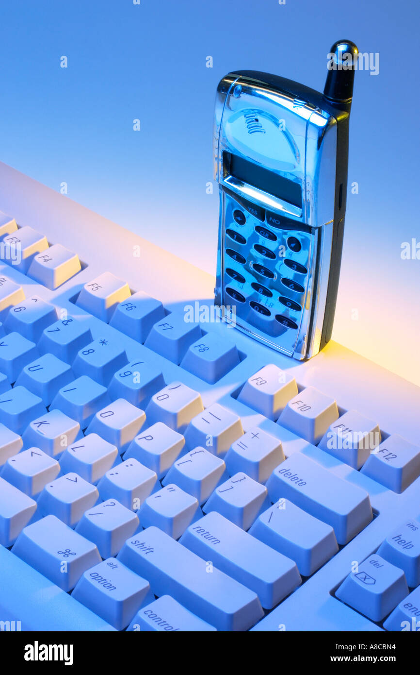 Mobile Phone and Computer Keyboard Stock Photo - Alamy