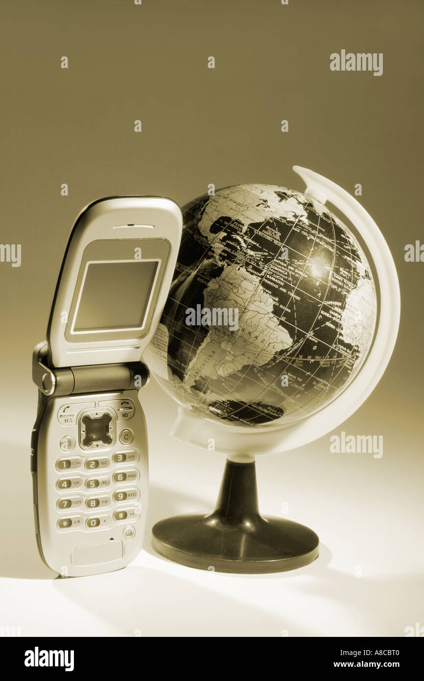 Mobile Phone and Desk Globe Stock Photo - Alamy