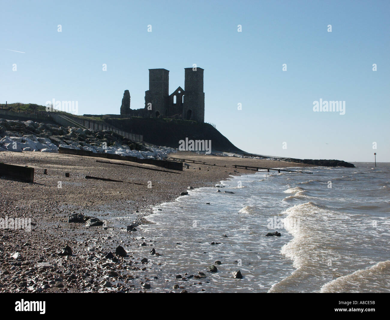 Silhouette & shoreline of twin towers of 12th century coastal landmark ...