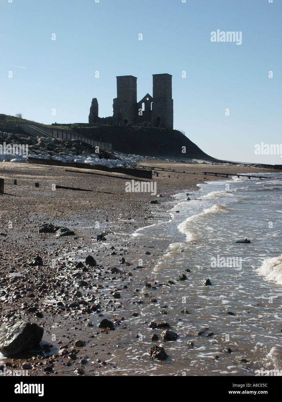 Silhouette & shoreline of twin towers of 12th century coastal landmark ...