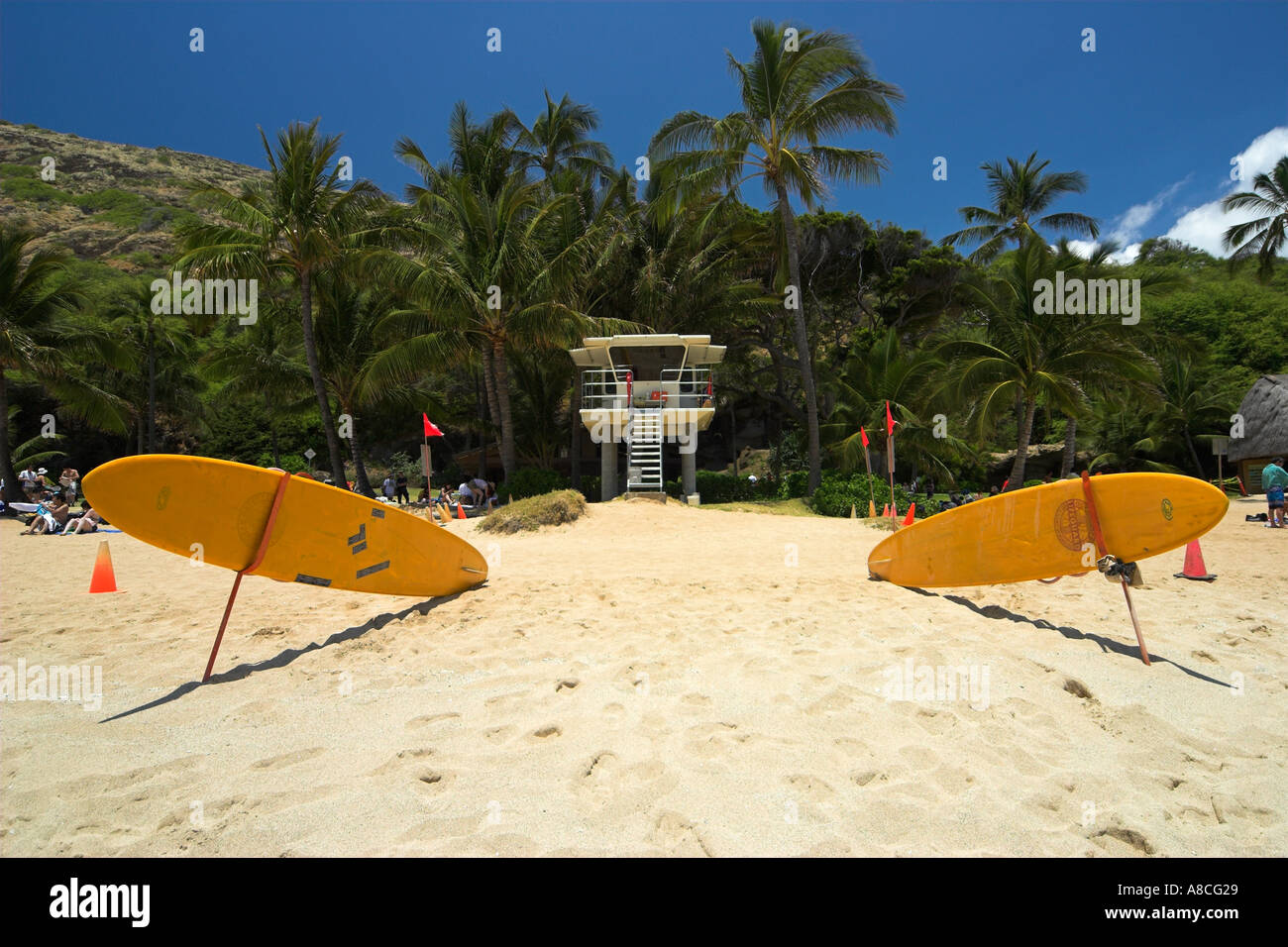 Lifeguard on duty with yellow surfboard pointing towards the Pacific ...