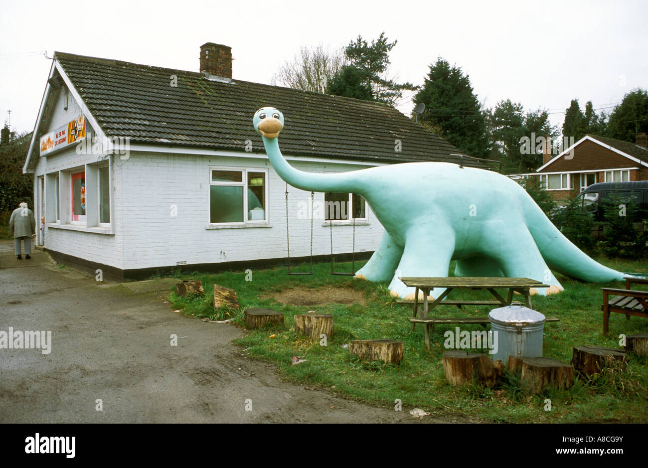 Concrete dinosaur outside motorway cafe, England Stock Photo - Alamy