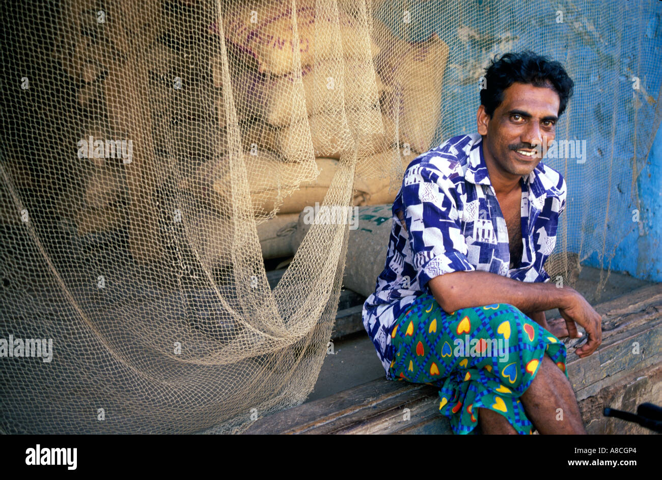 Grain and flour merchant sitting on his stall in Mattancherry Kerala ...