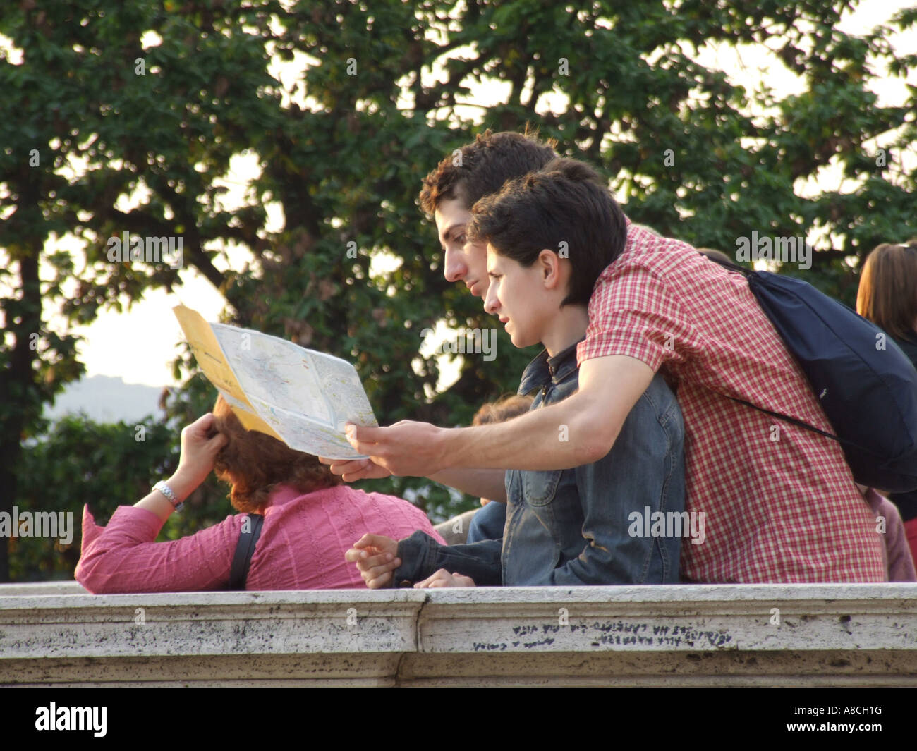 young couple looking at map at the pincio in villa borghese rome Stock ...