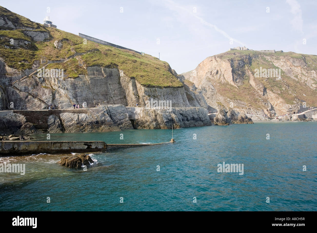 UK Lundy Island visitors walking along the new road from landing beach ...