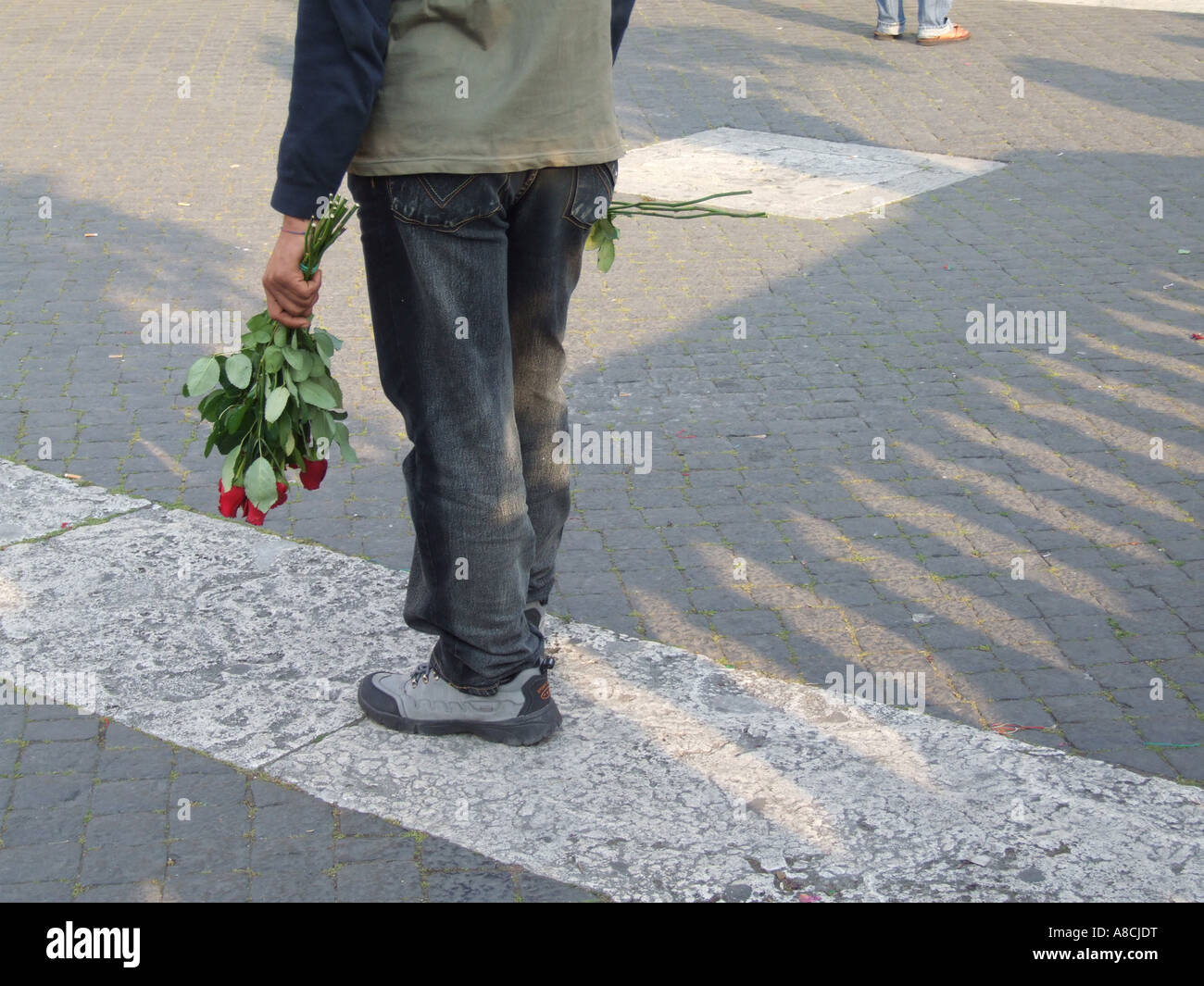 man holding bunch of red roses Stock Photo - Alamy