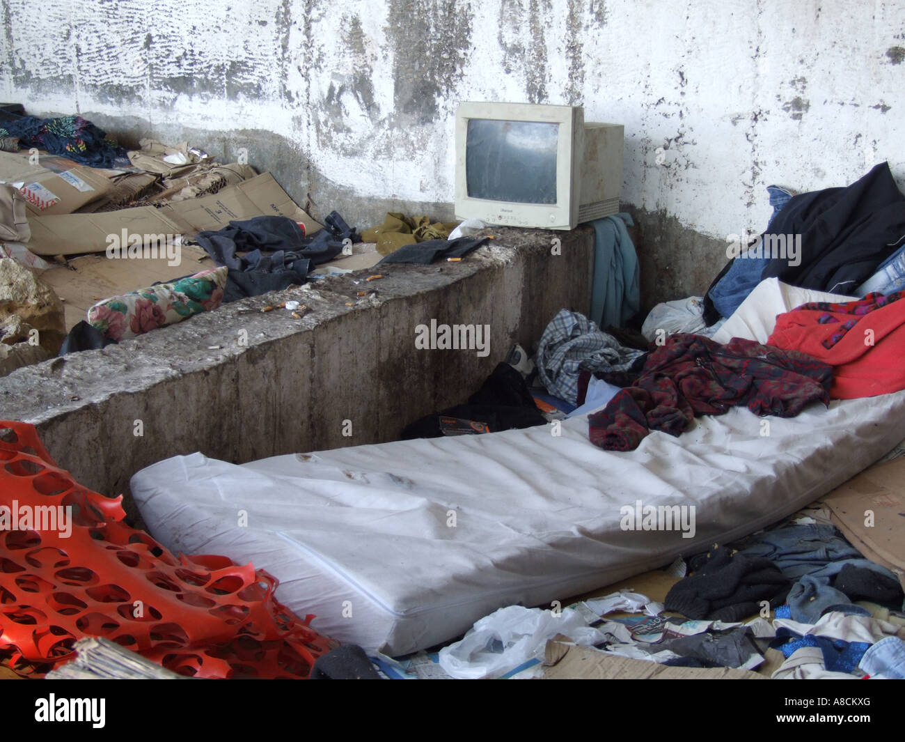 bed of homeless person under bridge Stock Photo - Alamy