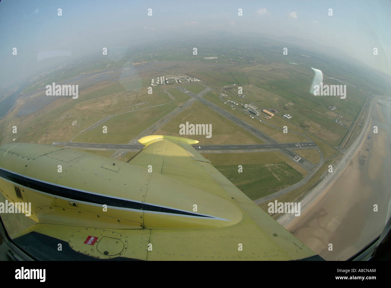 Piper Comanche completing circuit before landing at Caernarfon airfield ...