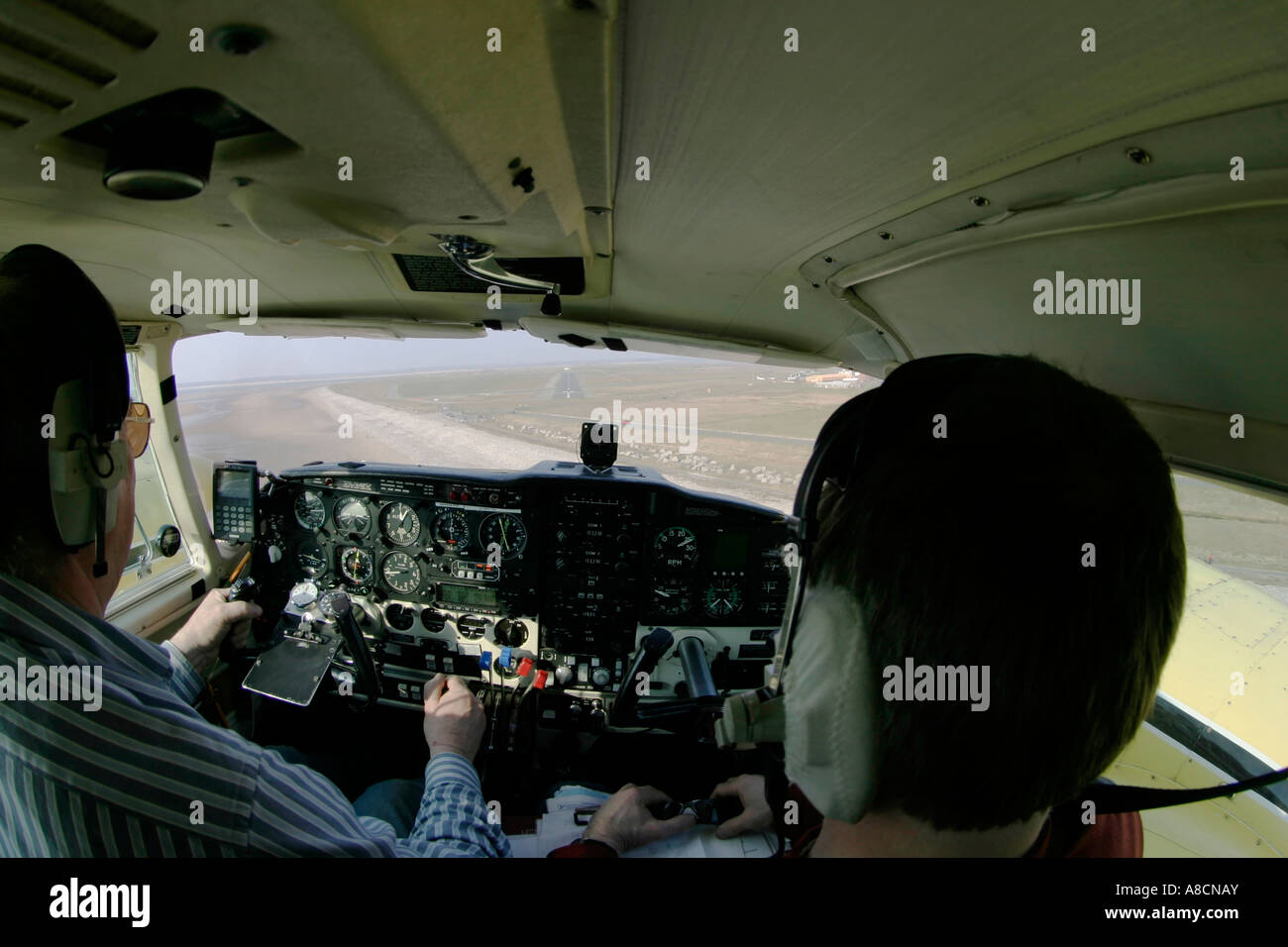 Inside a Piper twin Comanche on final approach to Caernarfon airfield ...