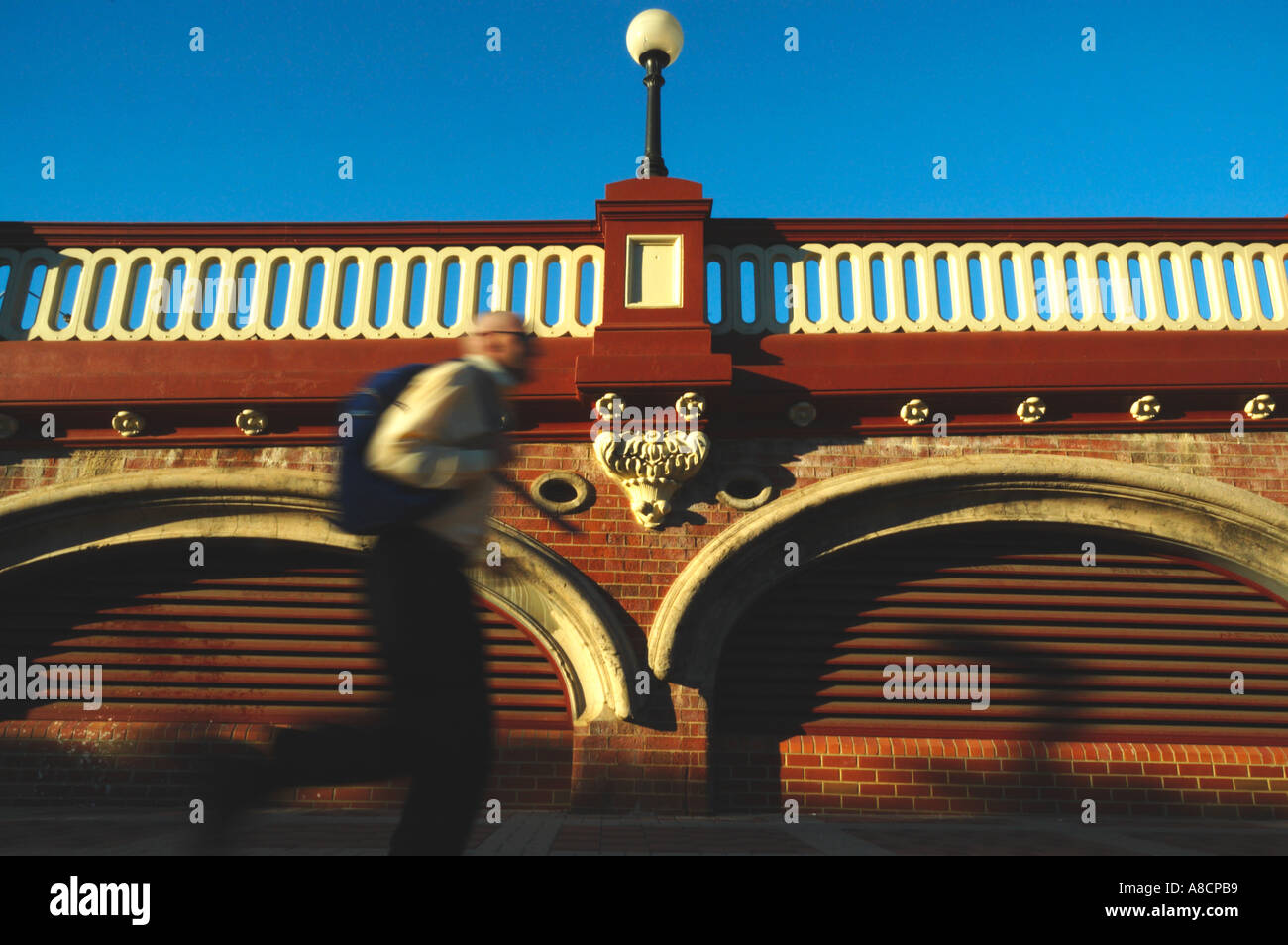 Western Australia Perth Office worker walking blurred in front of old ...