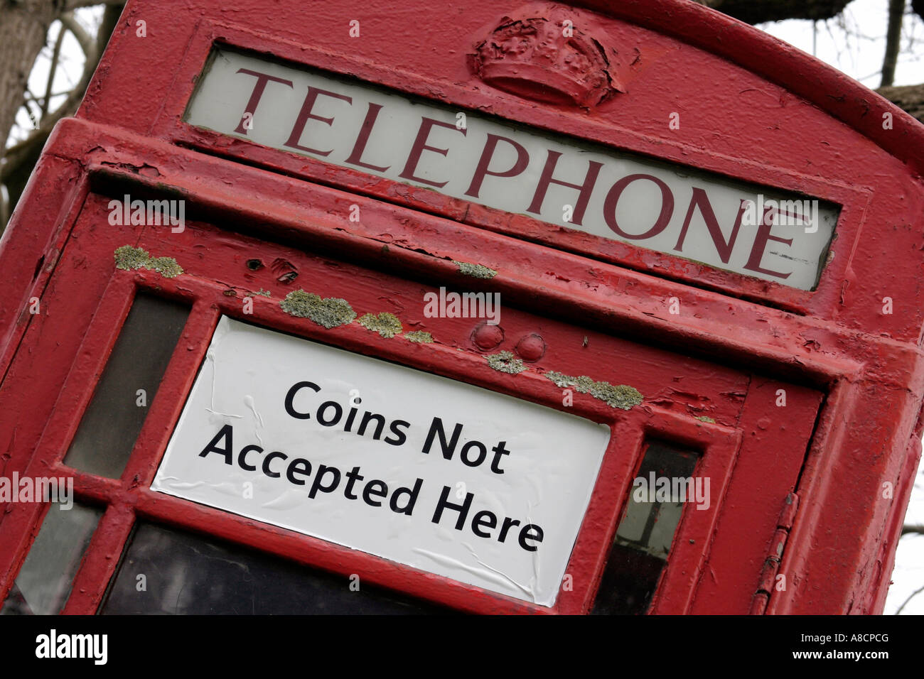 red telephone box with sign saying coins not accepted here Stock Photo ...