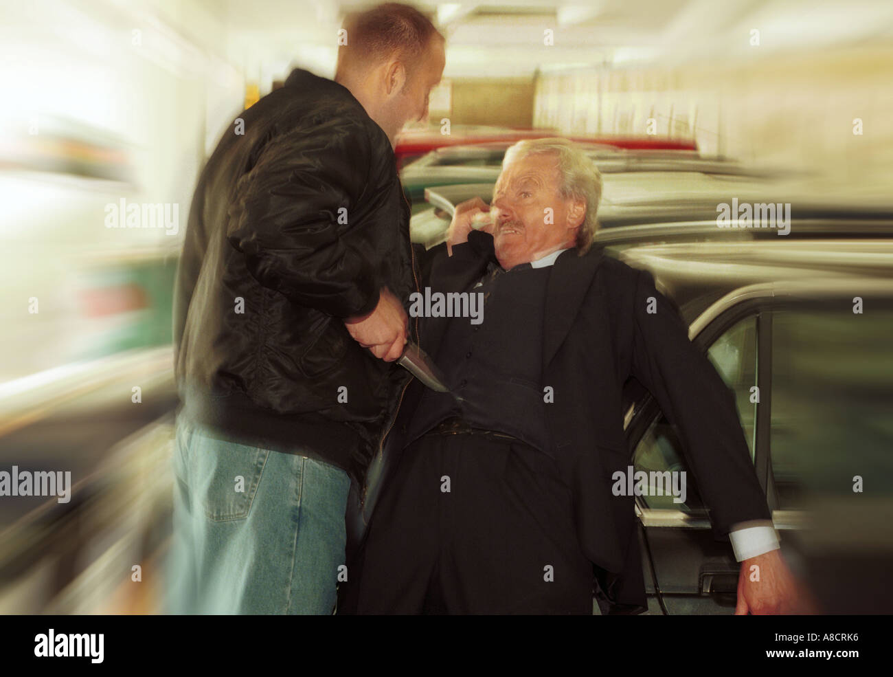 Mugged at knifepoint in a car park PICTURE POSED BY MODELS Stock Photo ...