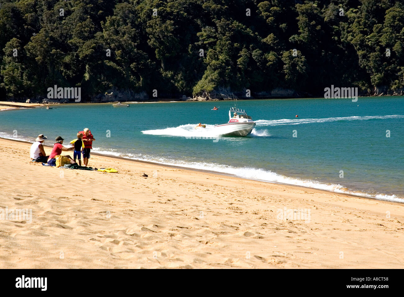 family boating Totaranui Able Tasman Track Stock Photo - Alamy