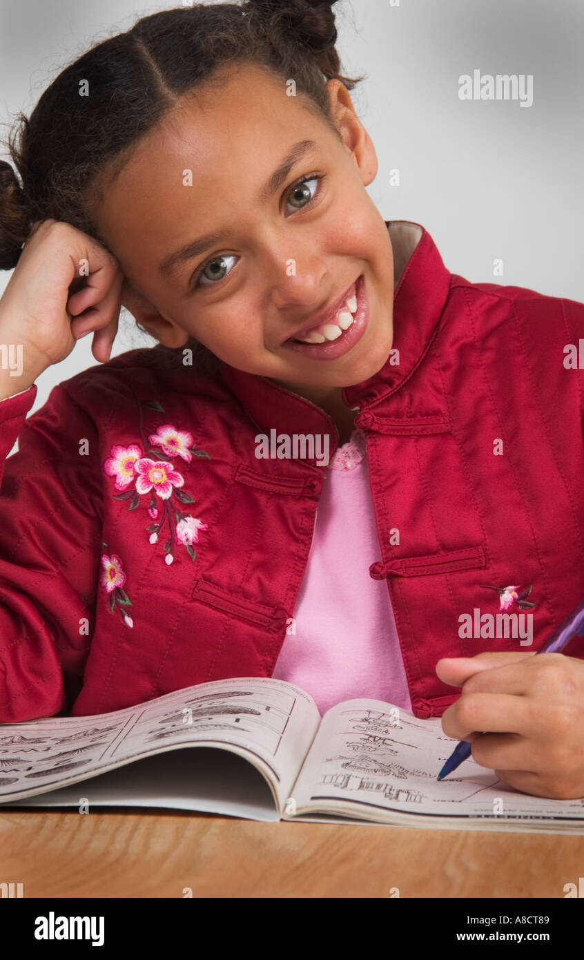 African American girl doing homework Stock Photo - Alamy