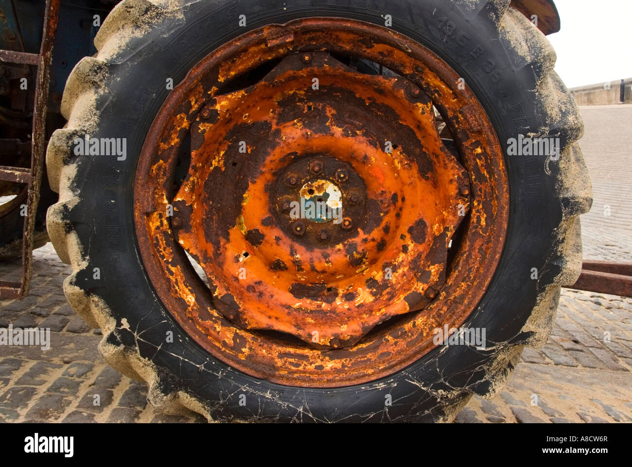 Rusty tractor wheel Stock Photo - Alamy