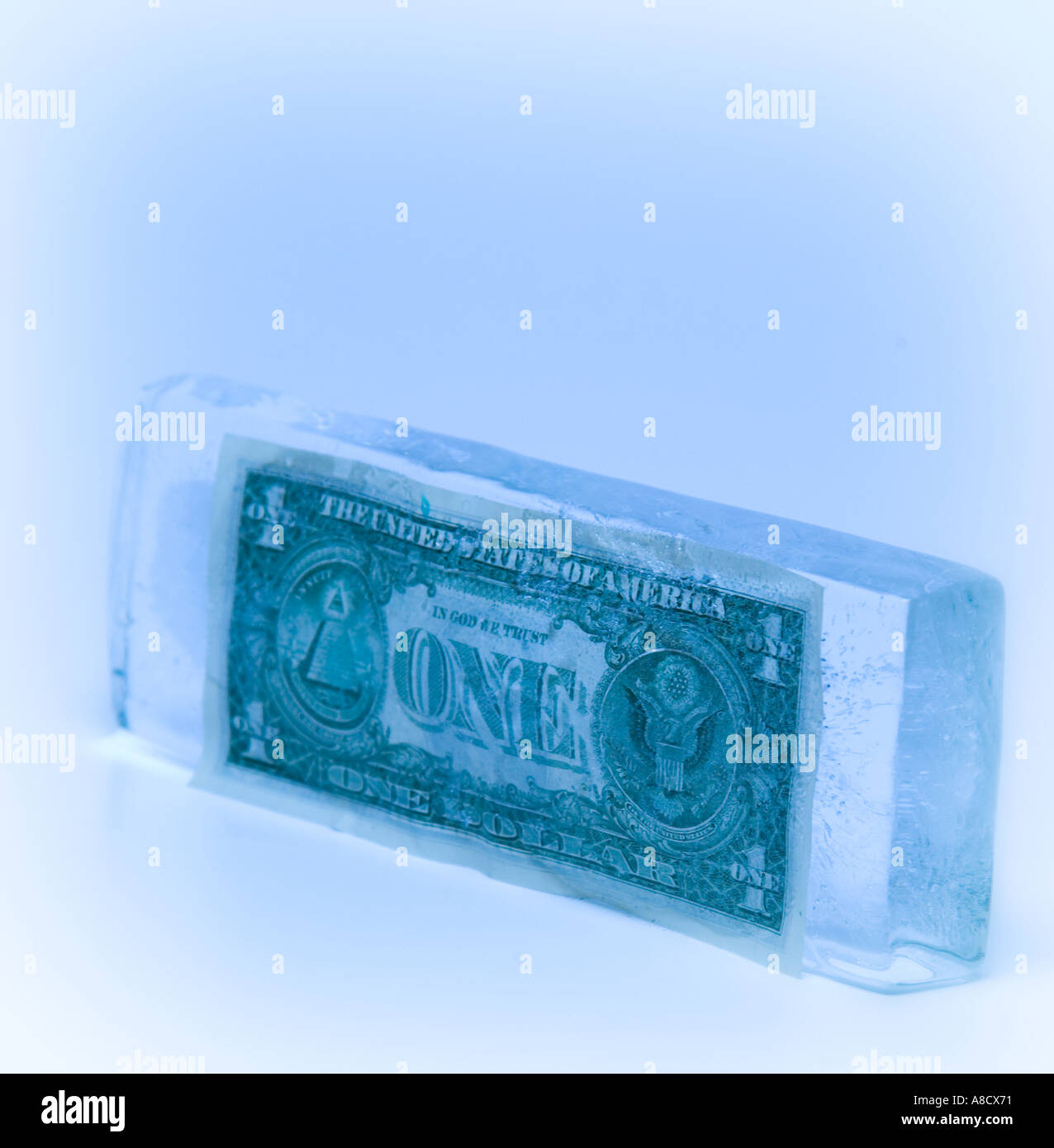 Money in ice Stock Photo - Alamy