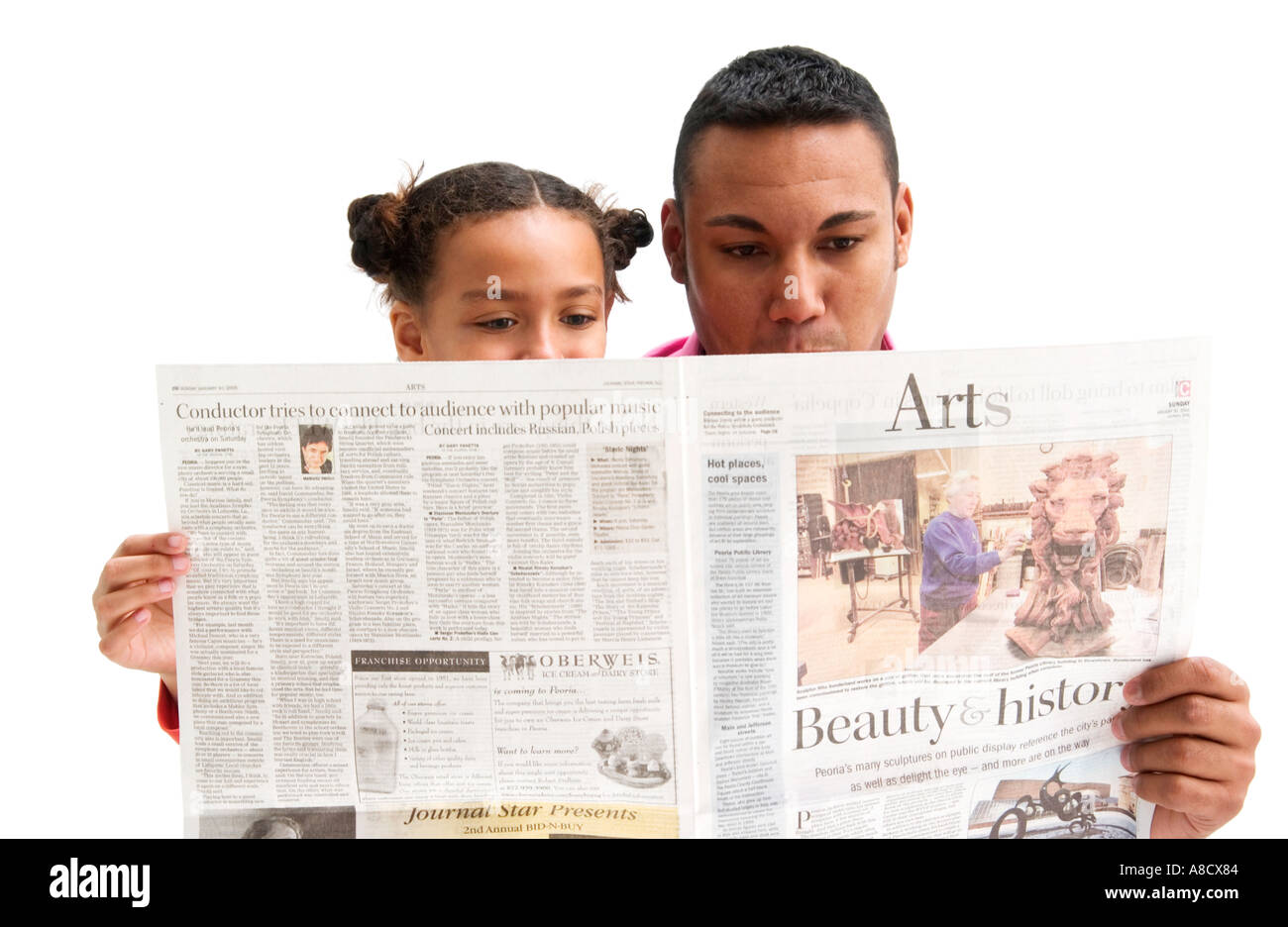 Father and daughter reading newspaper Stock Photo - Alamy