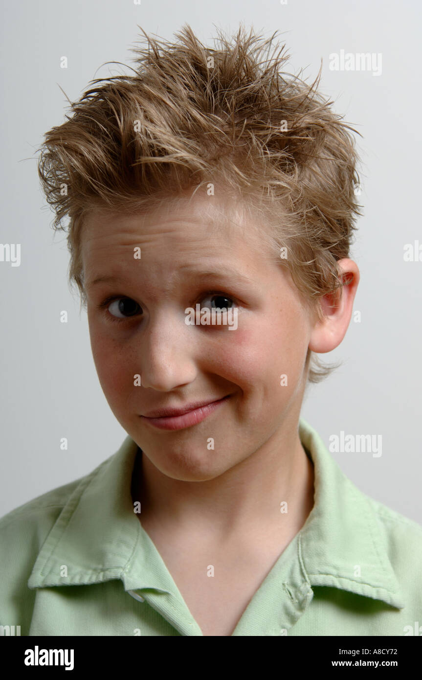 Boy smirk face hi-res stock photography and images - Alamy
