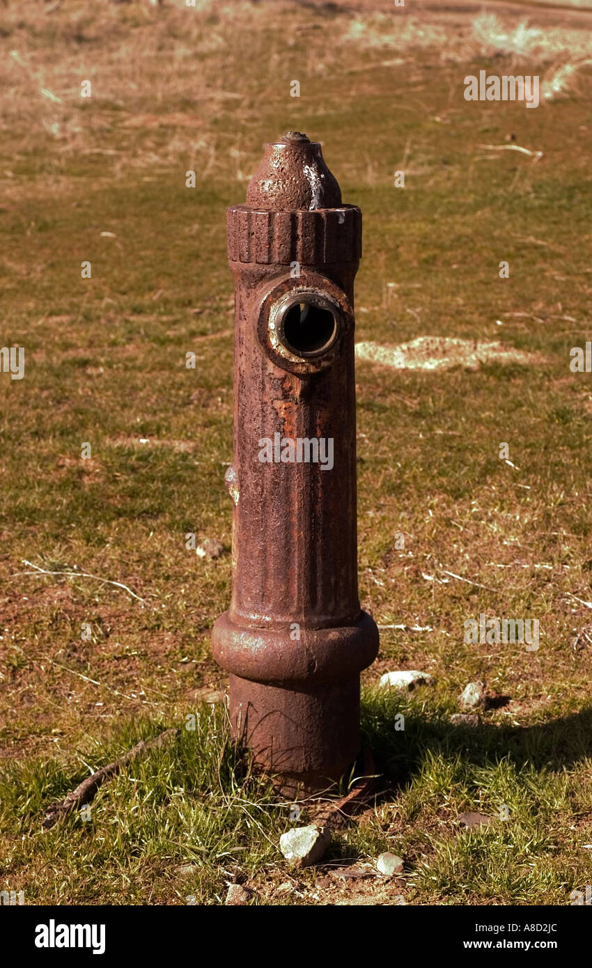 Fire hydrant with no caps at a ghost town Stock Photo - Alamy