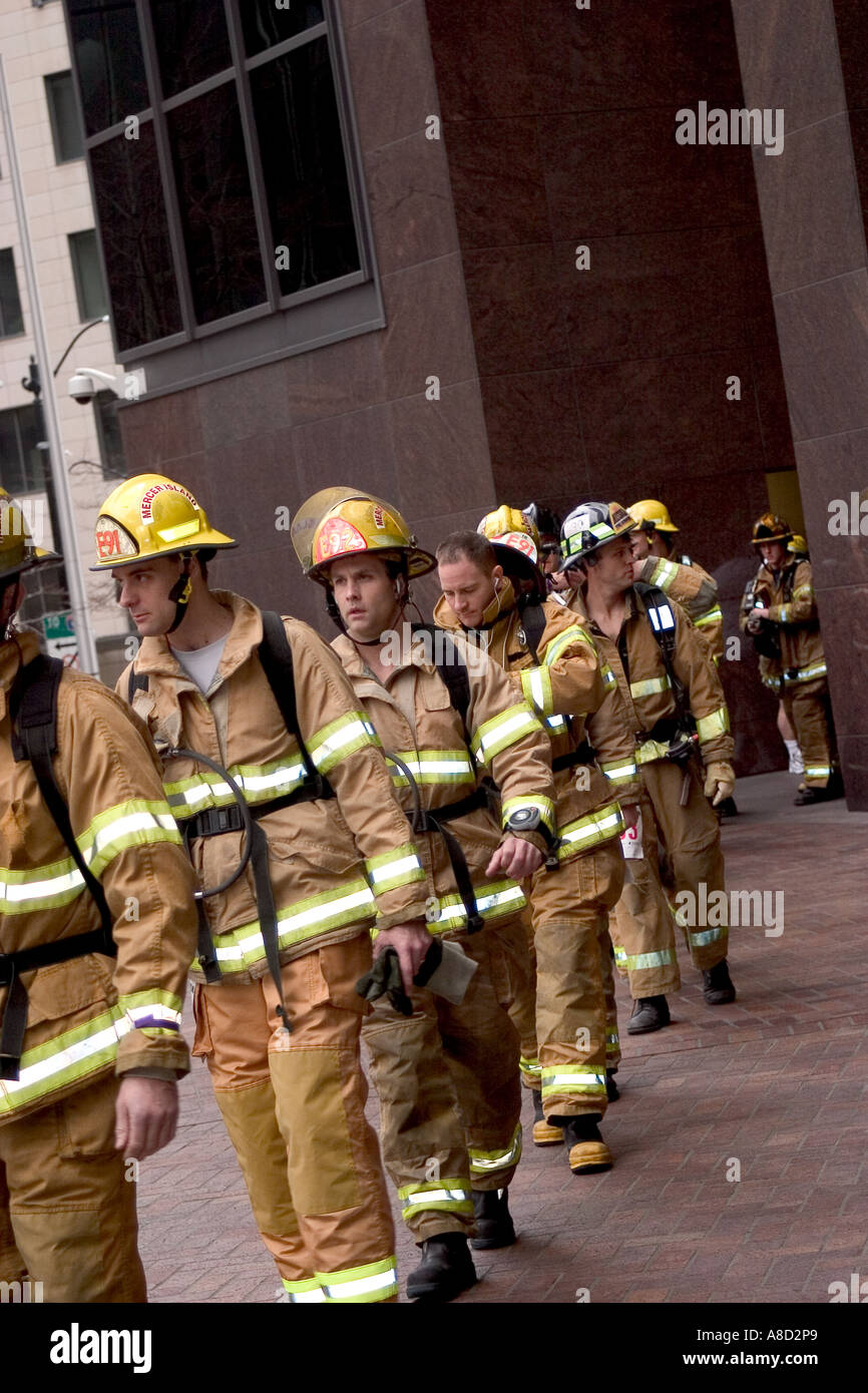 Firemen walking to the start of the Scott Firefighter Stair climb ...