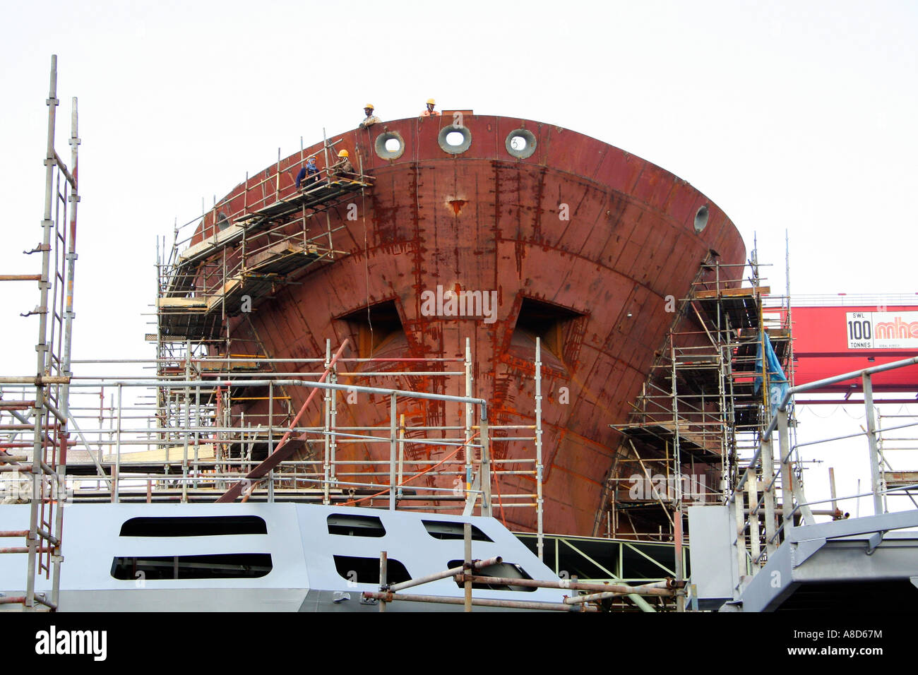 Commercial ship in dry dock being refurbished in Singapore Stock Photo ...