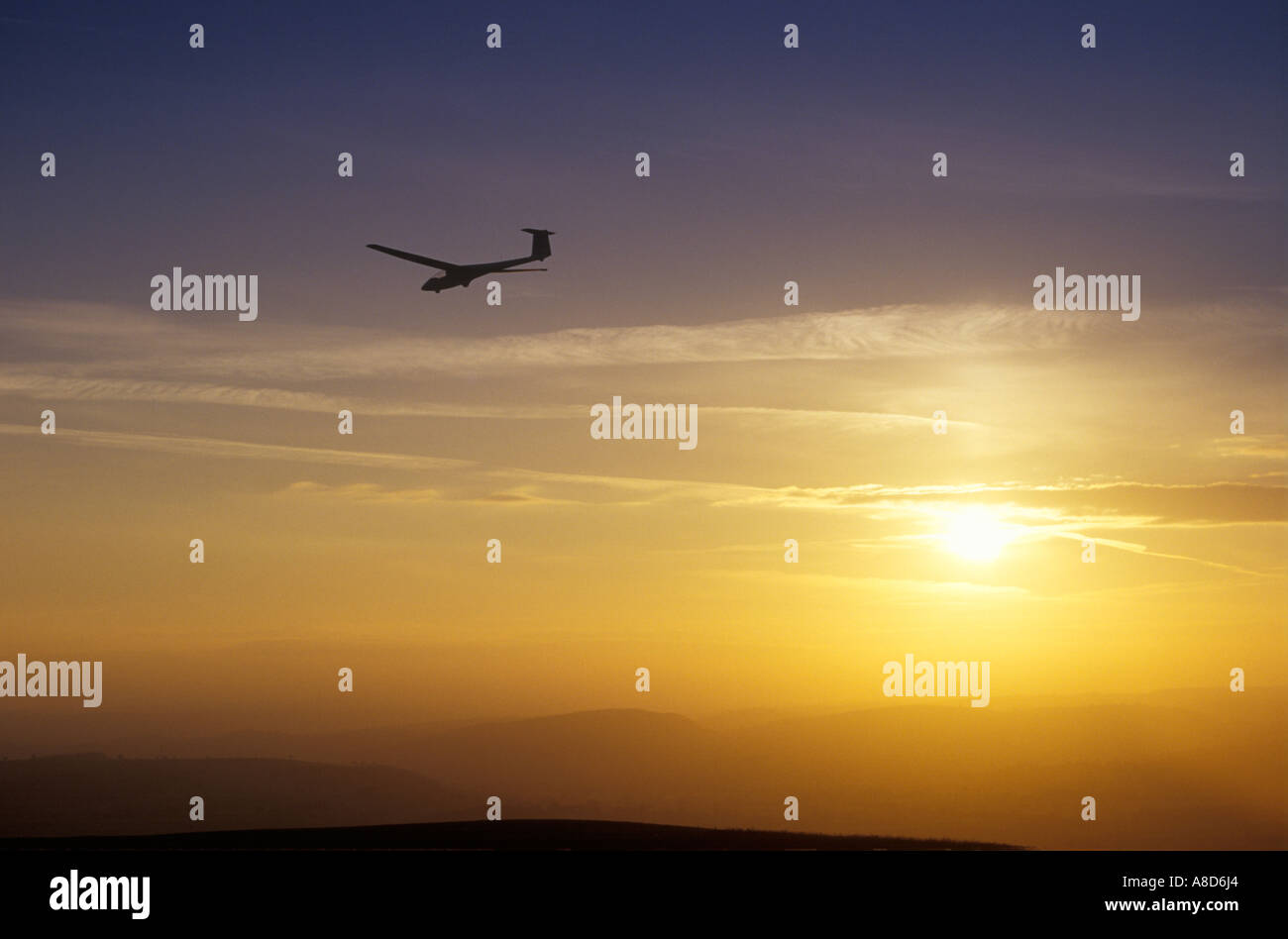 Glider in the sunset over the Long Mynd, Shropshire Stock Photo - Alamy