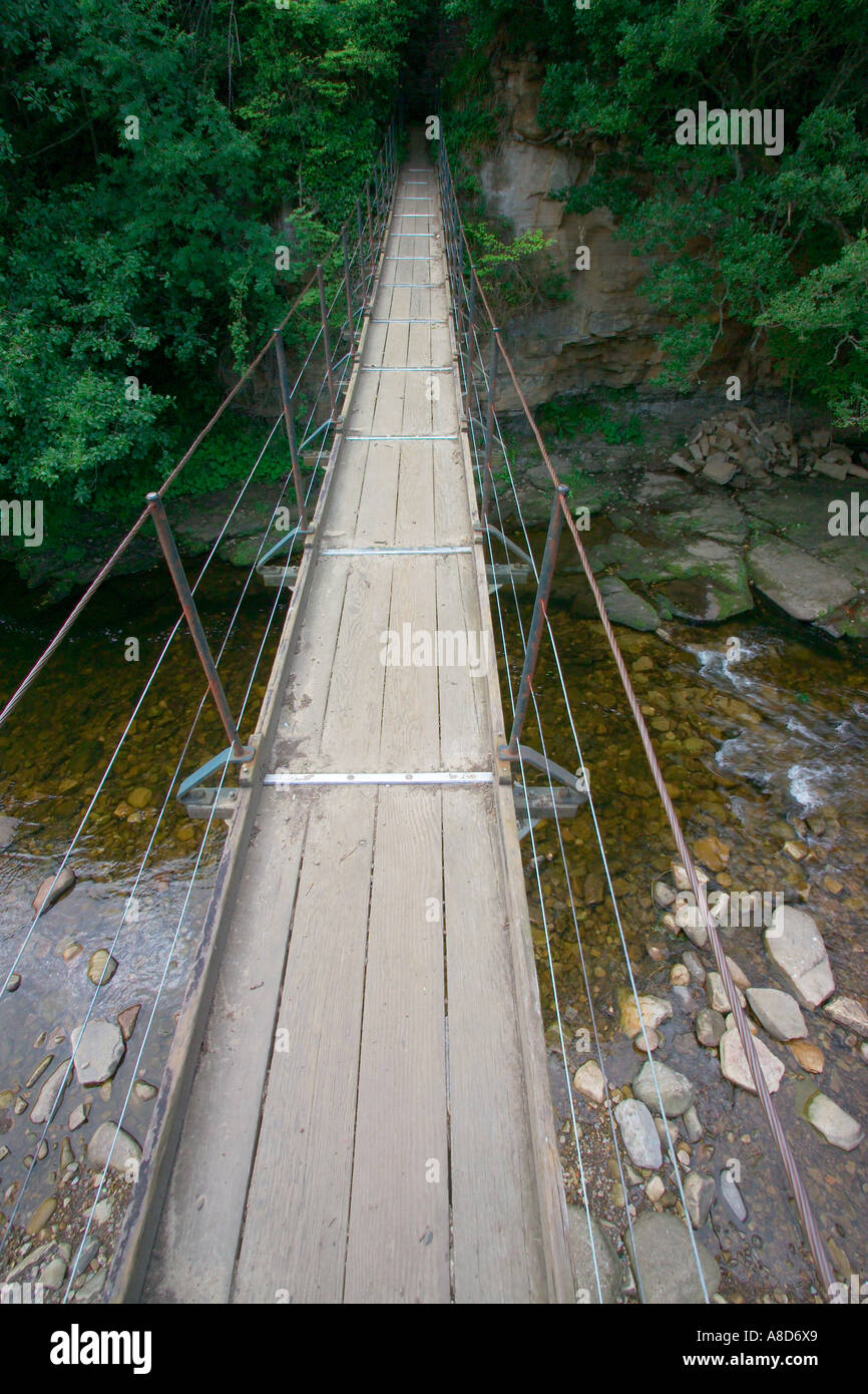 Suspension bridge carrying a footpath over the River Allen at Plankey ...