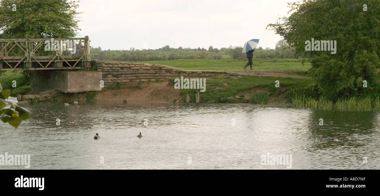 Bridge over the river in the rain Stock Photo - Alamy