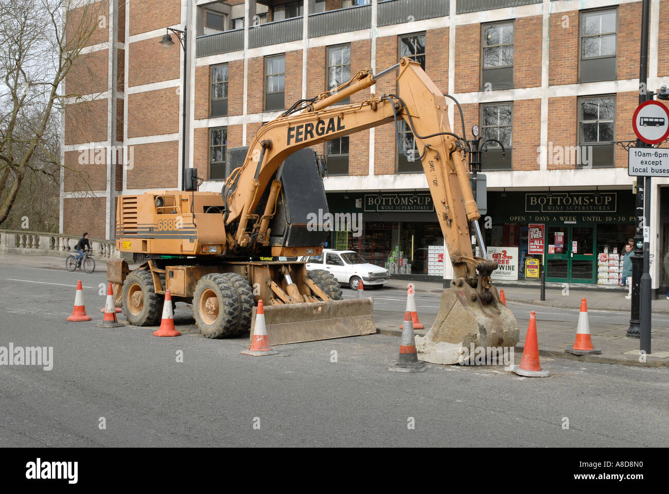 Mechanical digging machine parked in the centre of the road at the ...
