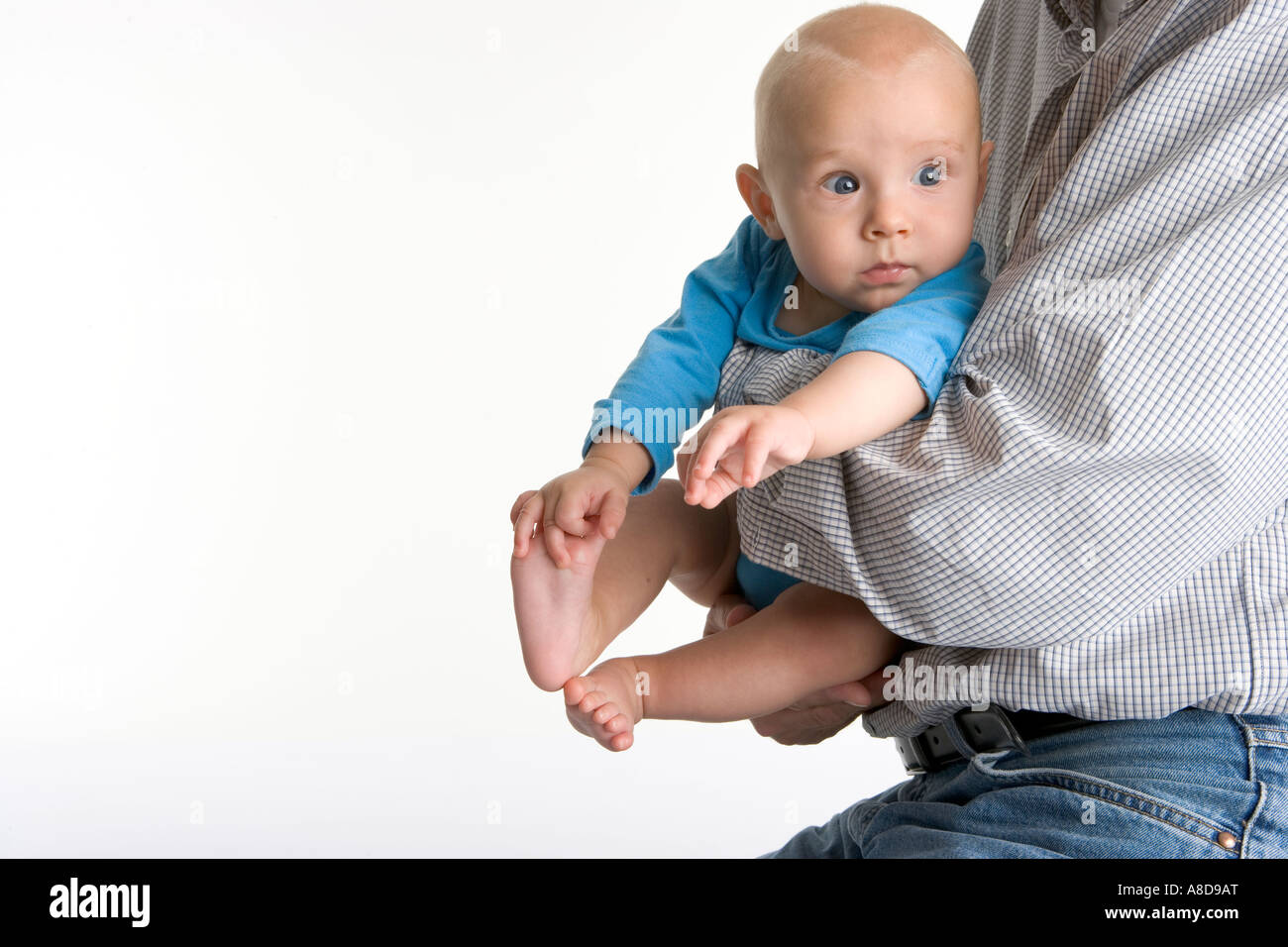 Little baby boy hanging in his fathers arm Stock Photo - Alamy