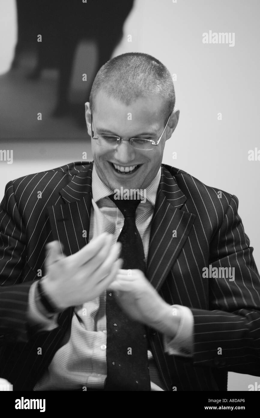 Businessman posing for a commercial photoshoot in office boardroom ...