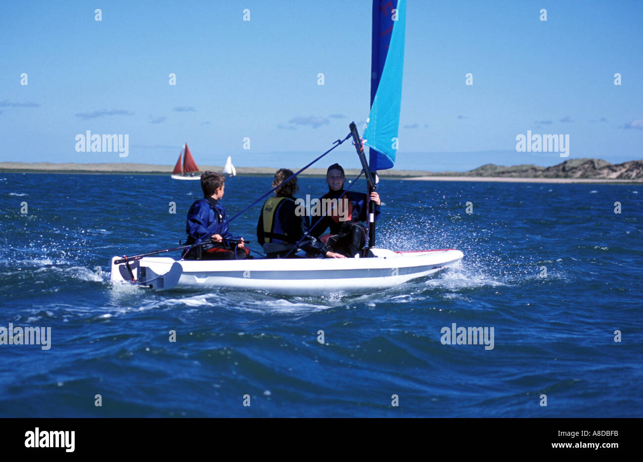 Kids dingy sailing Stock Photo - Alamy