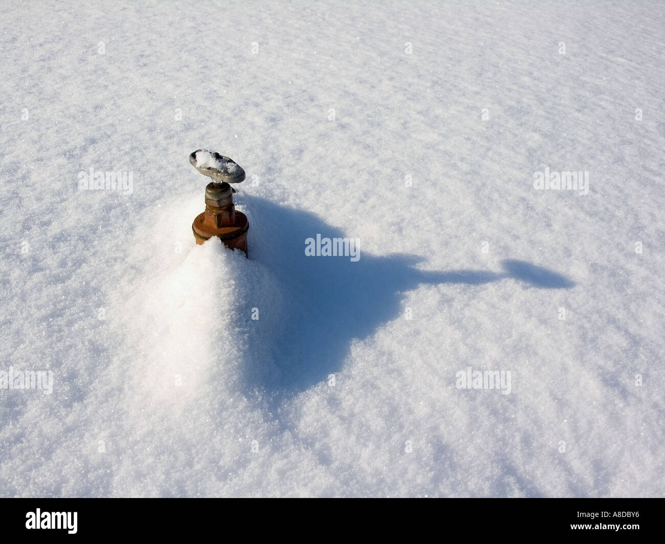 Waterline and tap under snow Stock Photo - Alamy
