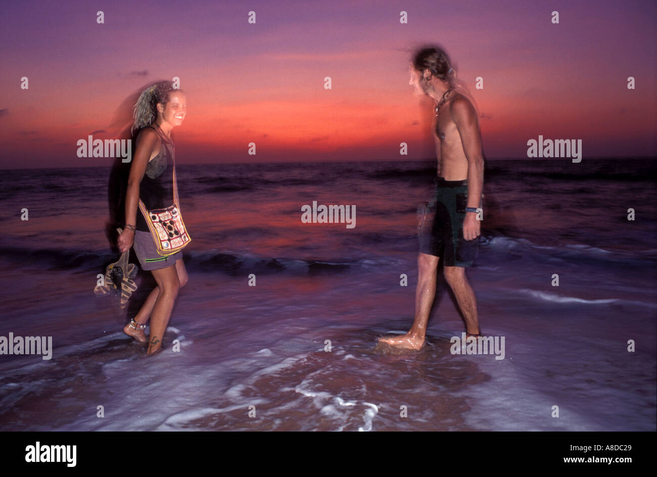 Couple Partying in the surf Anjuna beach Goa India Stock Photo - Alamy