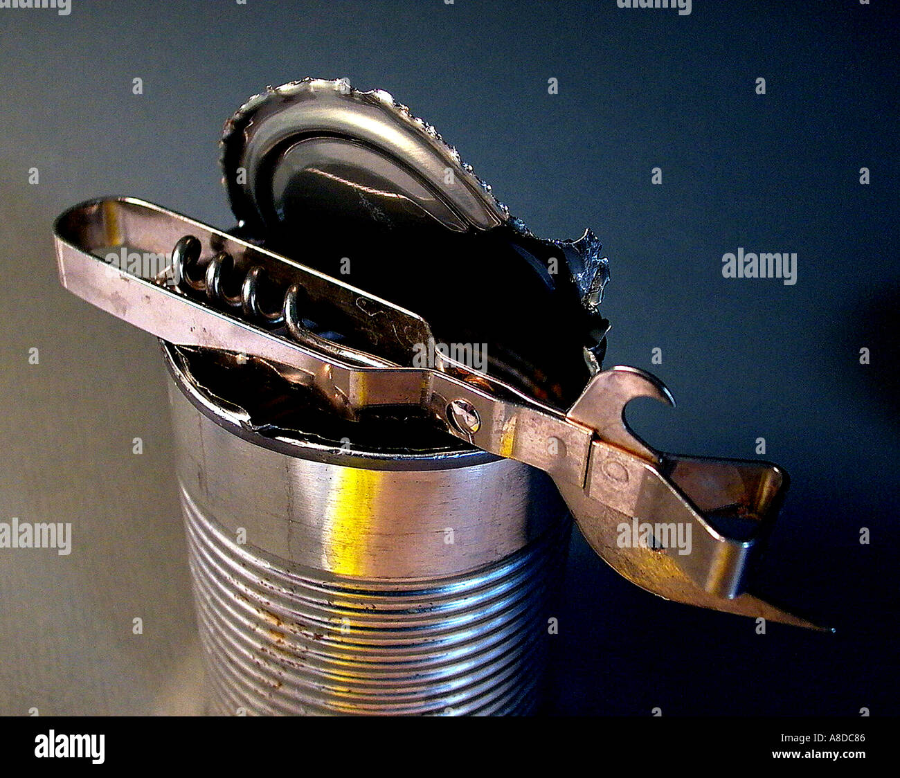 Can opener and tin can Stock Photo - Alamy