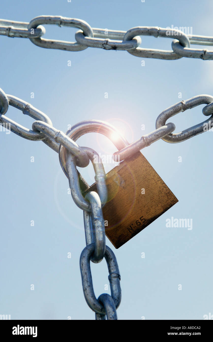 Ends of chain connected by closed lock Stock Photo - Alamy