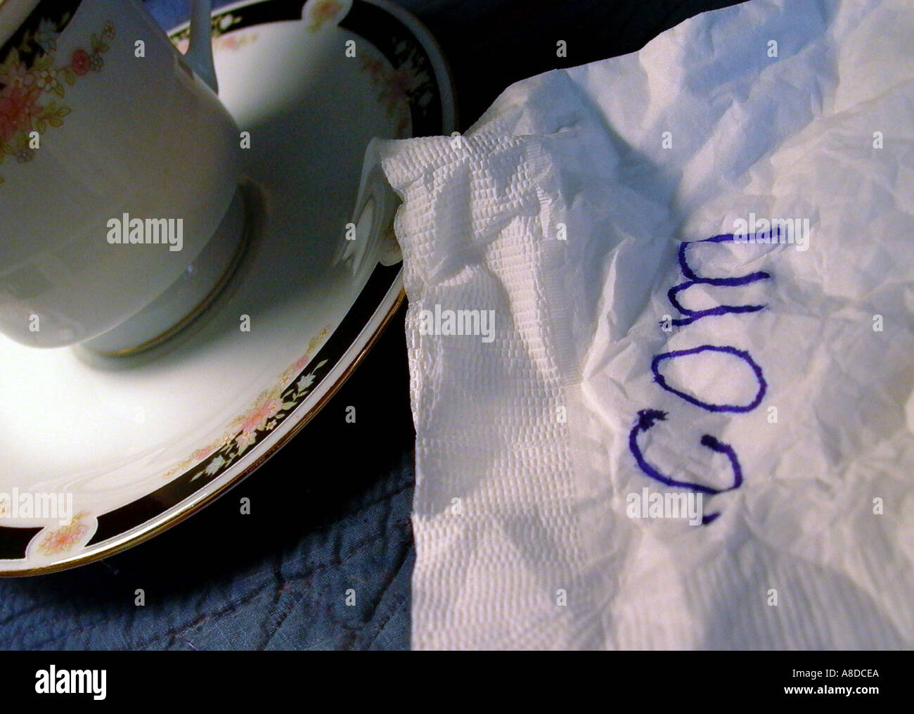 note written on crumpled napkin next to tea cup Stock Photo - Alamy