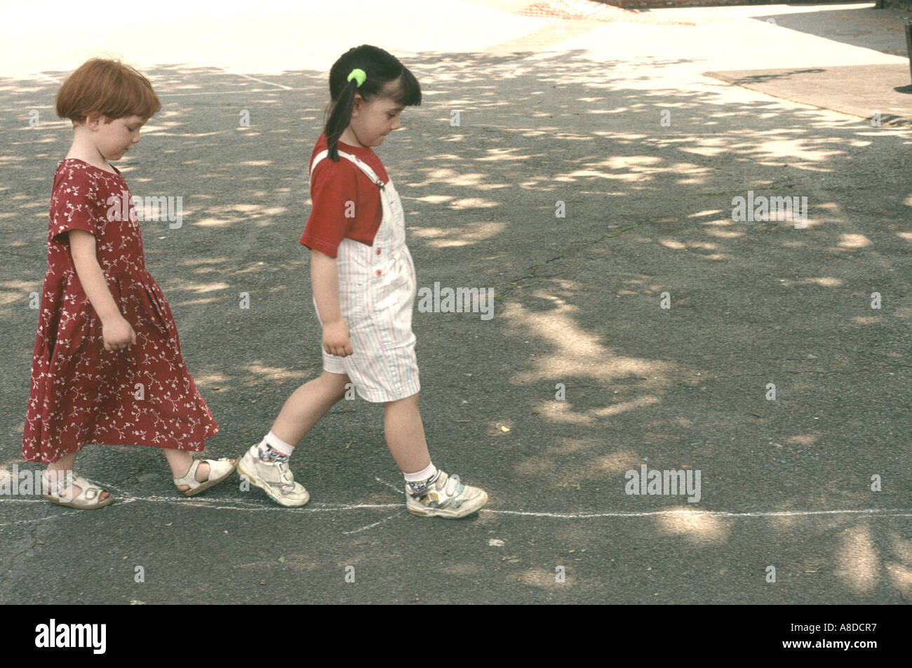 Primary school girls playing in the school playground Stock Photo - Alamy