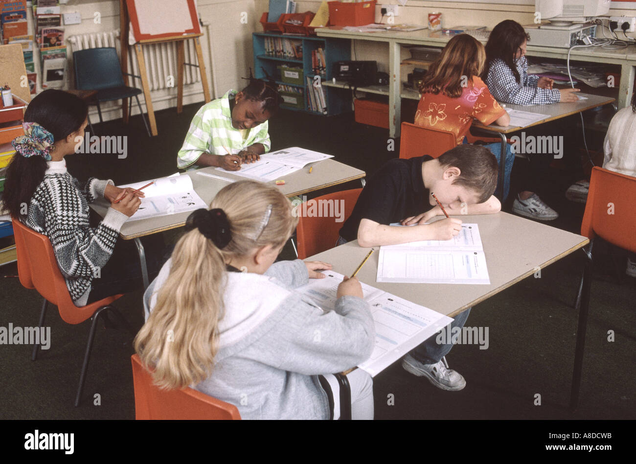 Ten year old girls and boys taking their SATS test Stock Photo - Alamy