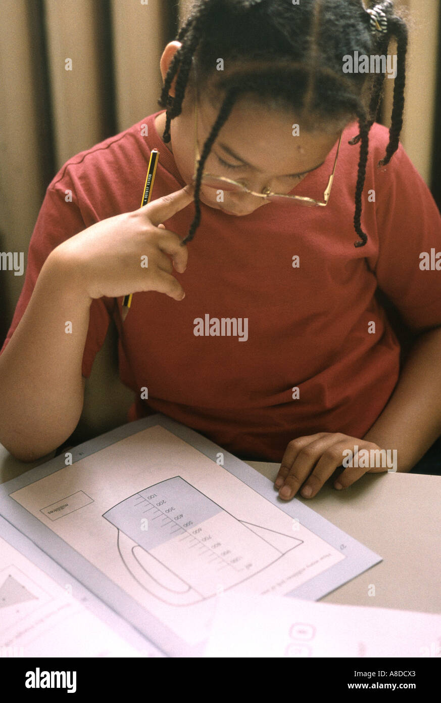 Ten year old girl taking her SATS test Stock Photo - Alamy