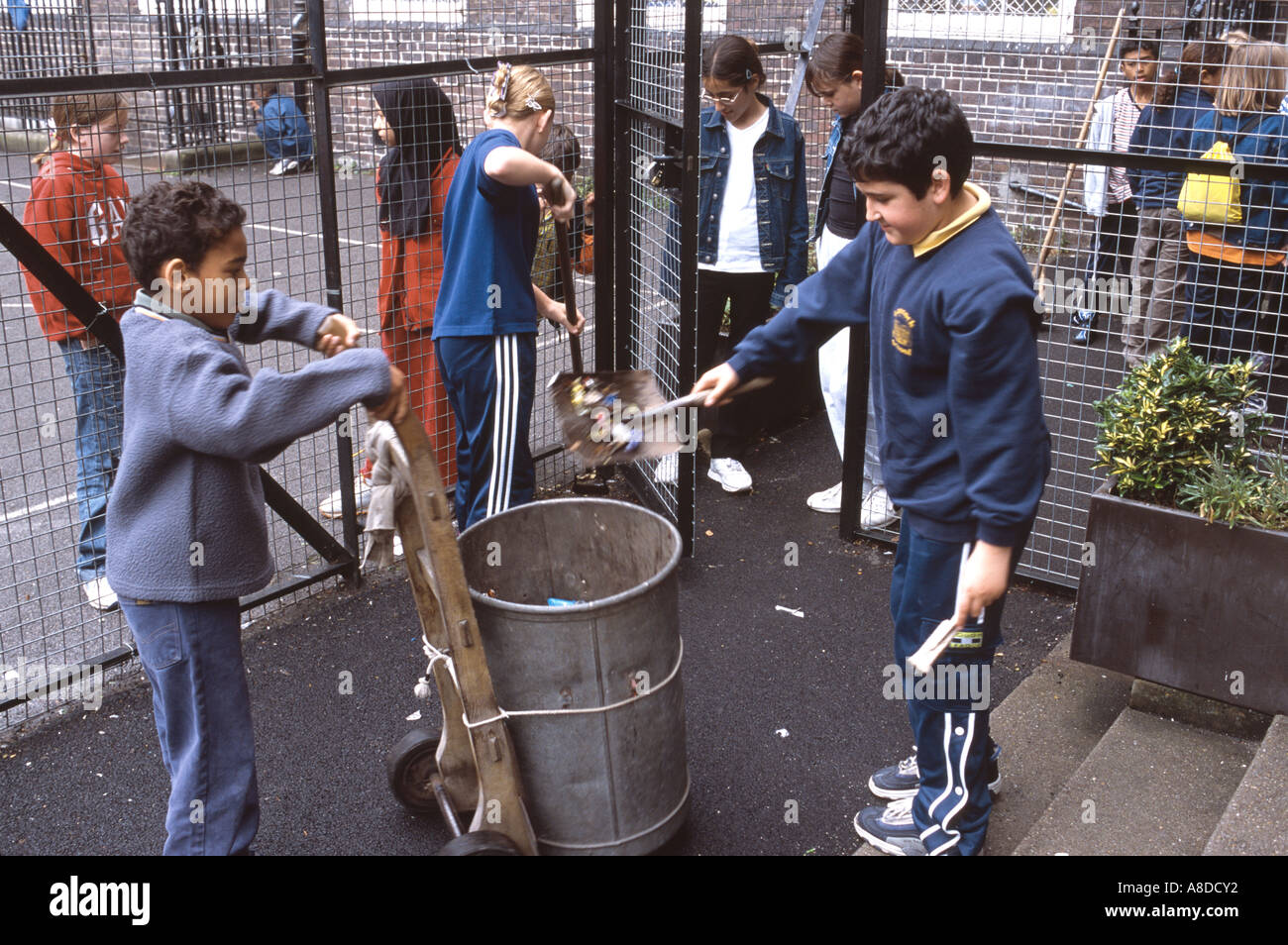 primary school children cleaning up the playground Stock Photo - Alamy