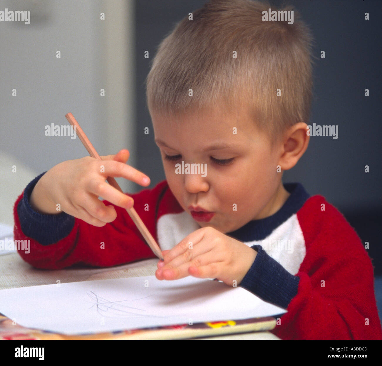 Boy is drawing Stock Photo - Alamy
