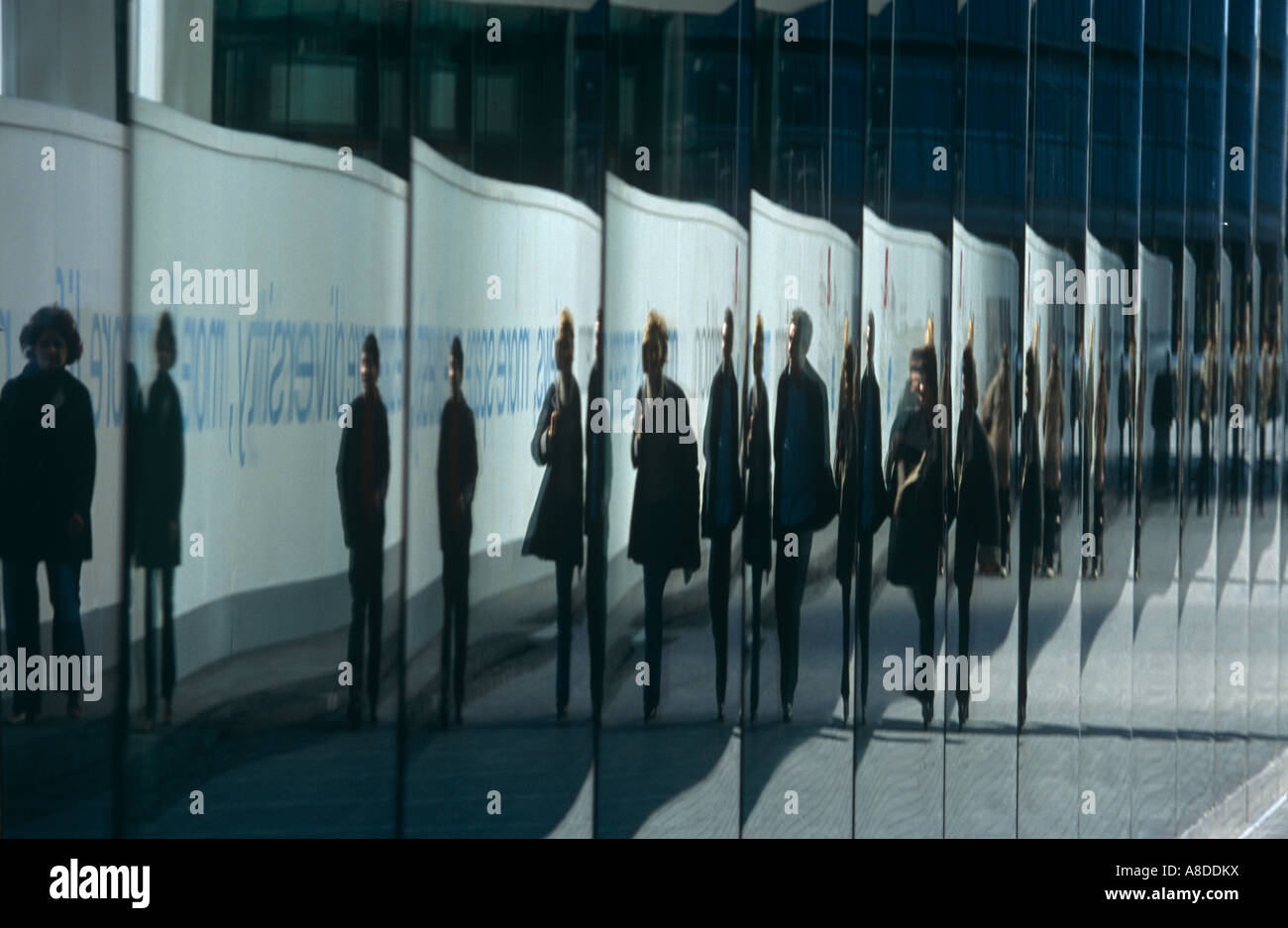 Refracted figures walk through an office window on the southern bank of ...