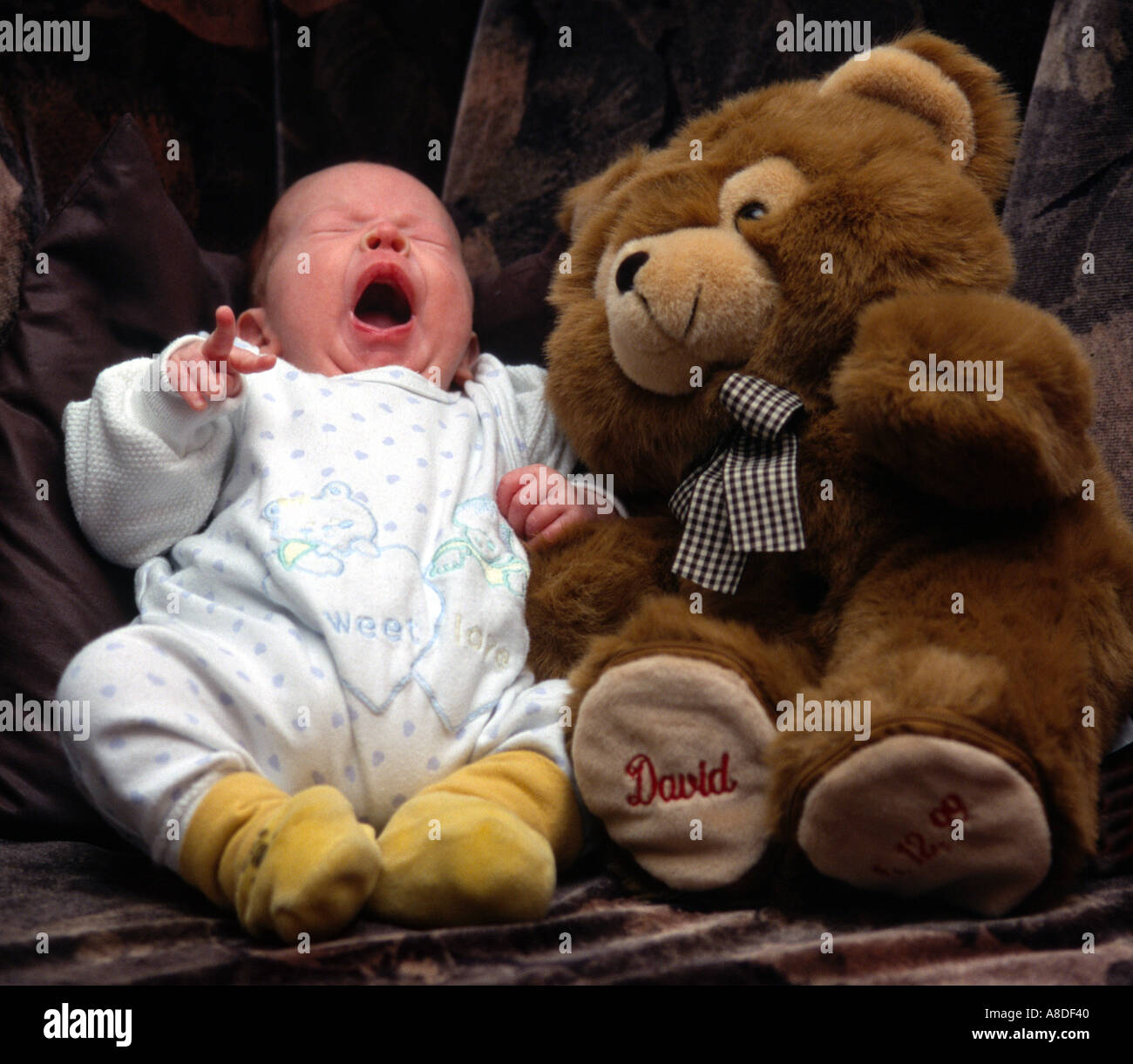 Baby and teddy bear Stock Photo - Alamy