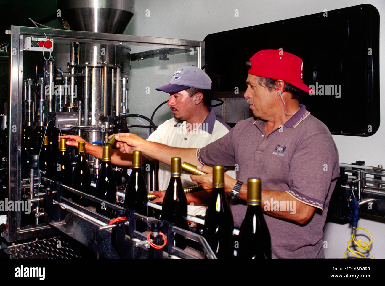 A PORTABLE WINE BOTTLING PLANT housed in a semi truck at work in a ...