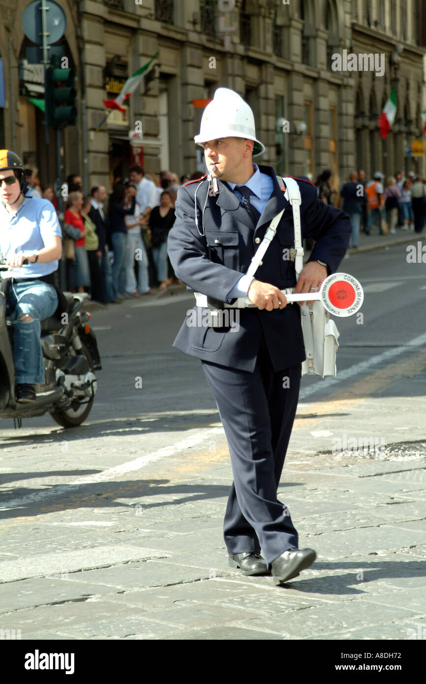 Italian policeman on duty in road wearing white helmet Florence Tuscany ...